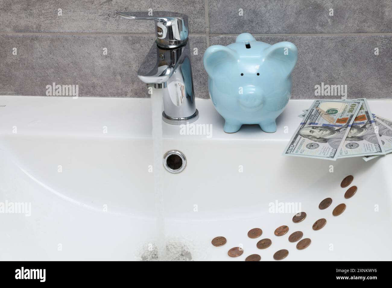Water saving concept. Piggy bank, stream of water flowing from tap and ...