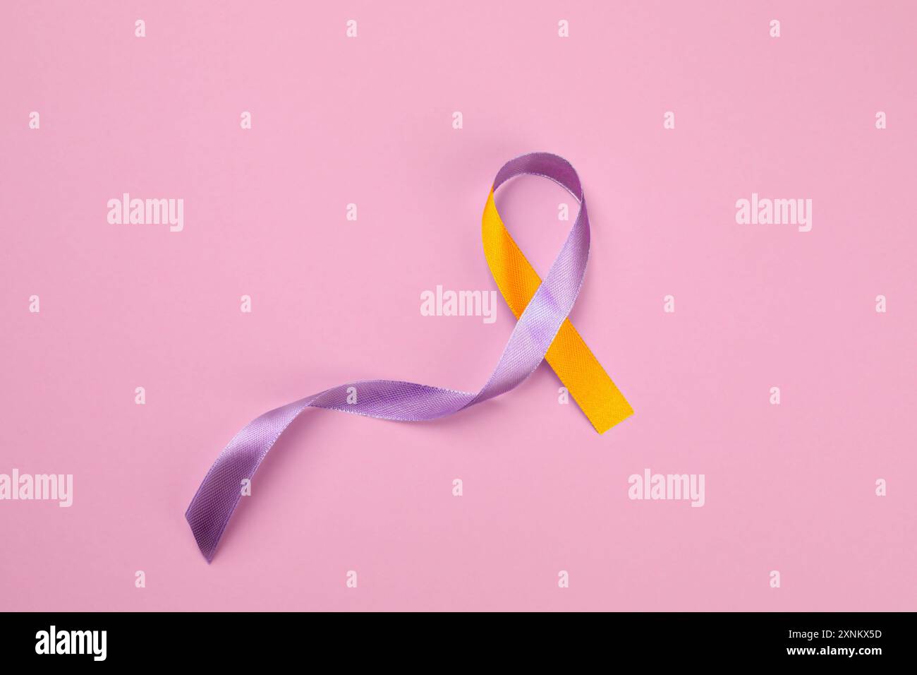 World Psoriasis Day. Orange and orchid awareness ribbon as symbol of ...