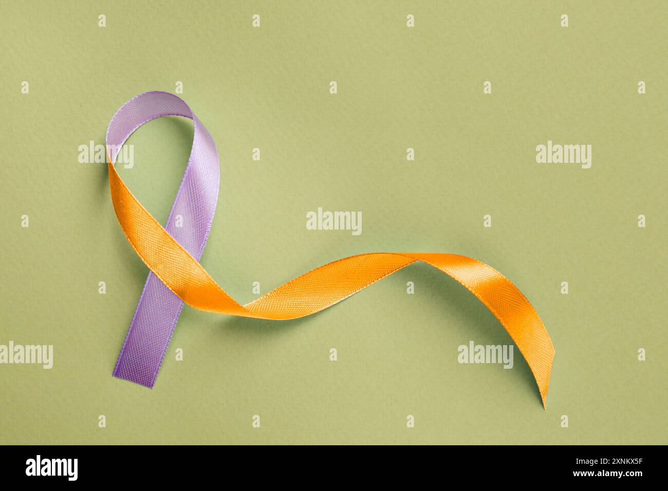 World Psoriasis Day. Orange and orchid awareness ribbon as symbol of ...