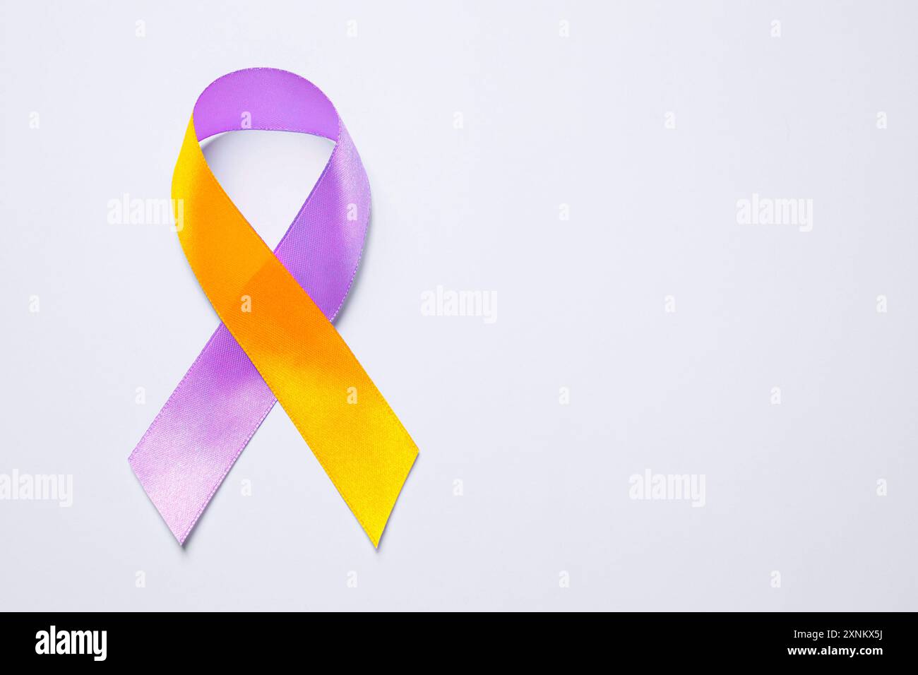 World Psoriasis Day. Orange and orchid awareness ribbon as symbol of ...