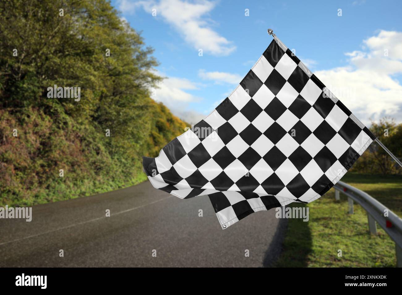 Checkered finish flag and asphalt racing track outdoors Stock Photo - Alamy