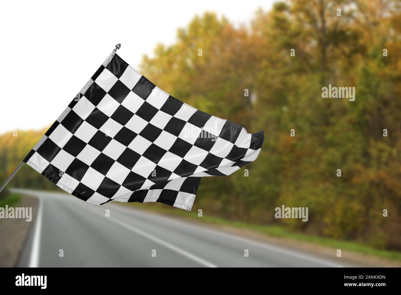 Checkered finish flag and asphalt racing track outdoors Stock Photo - Alamy