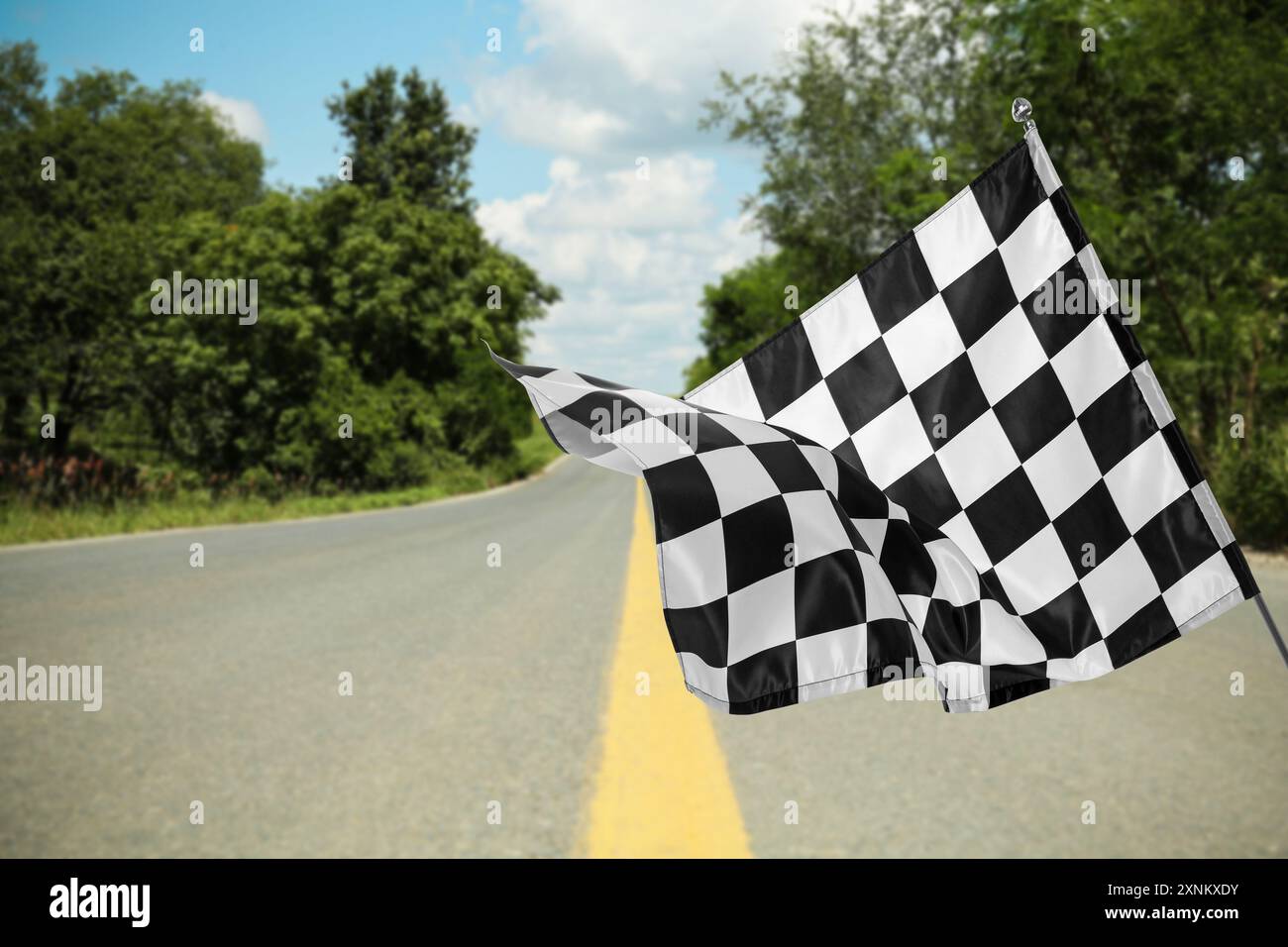Checkered finish flag and asphalt racing track outdoors Stock Photo - Alamy
