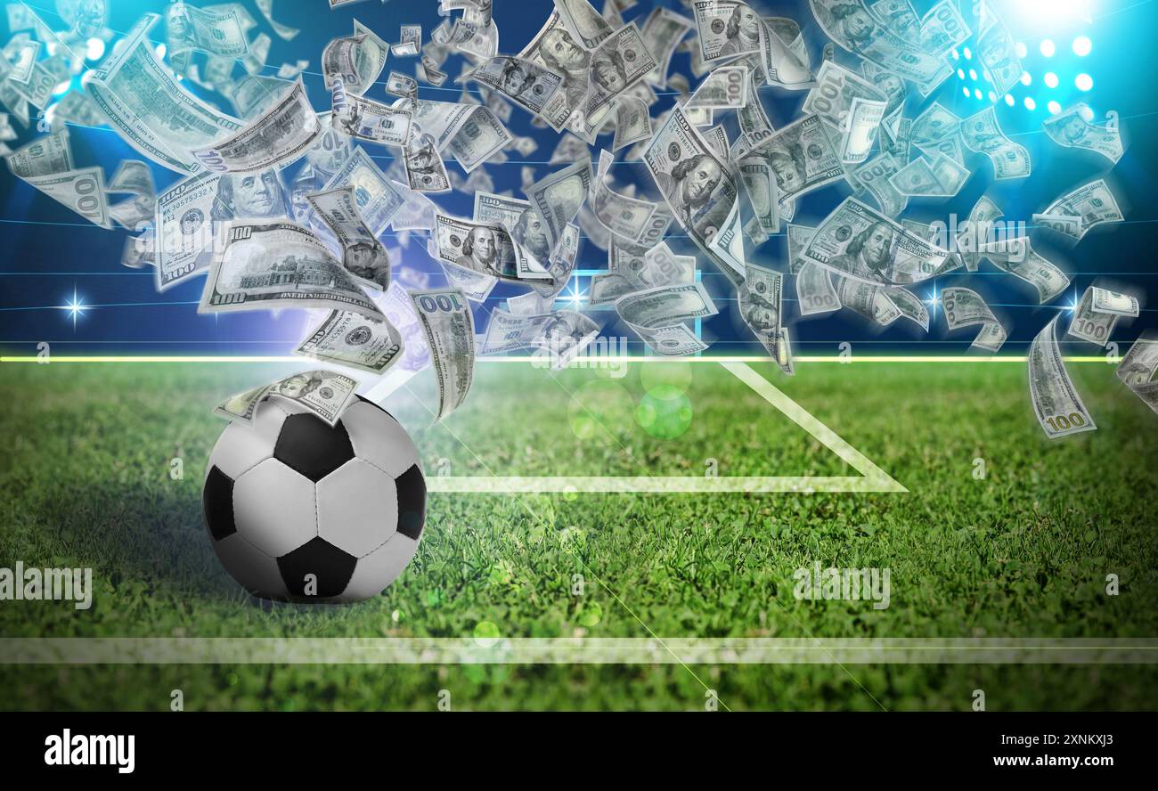Money flying from soccer ball on stadium Stock Photo - Alamy