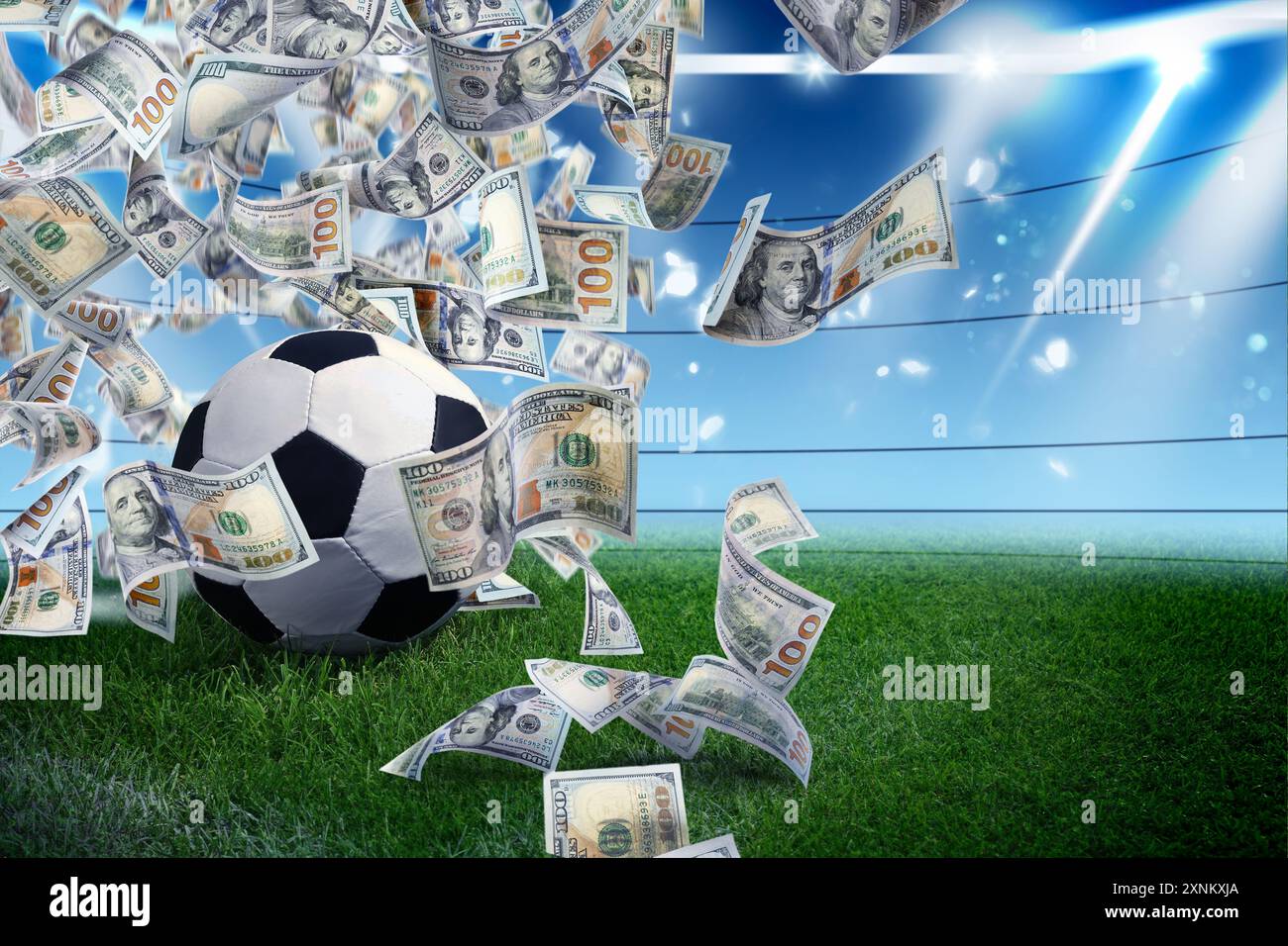 Soccer ball under money rain on stadium Stock Photo - Alamy