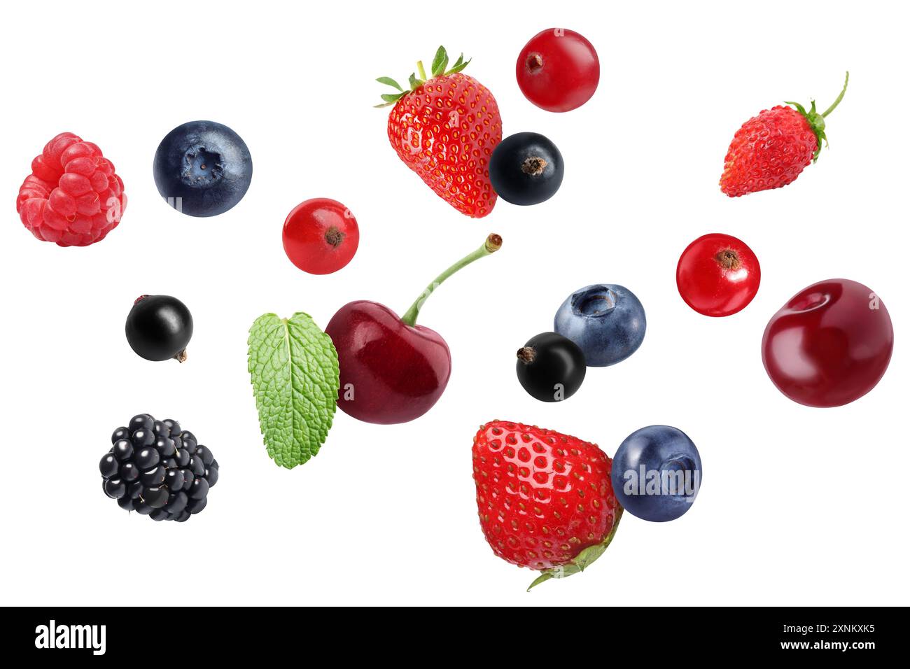 Different fresh berries in air on white background Stock Photo - Alamy