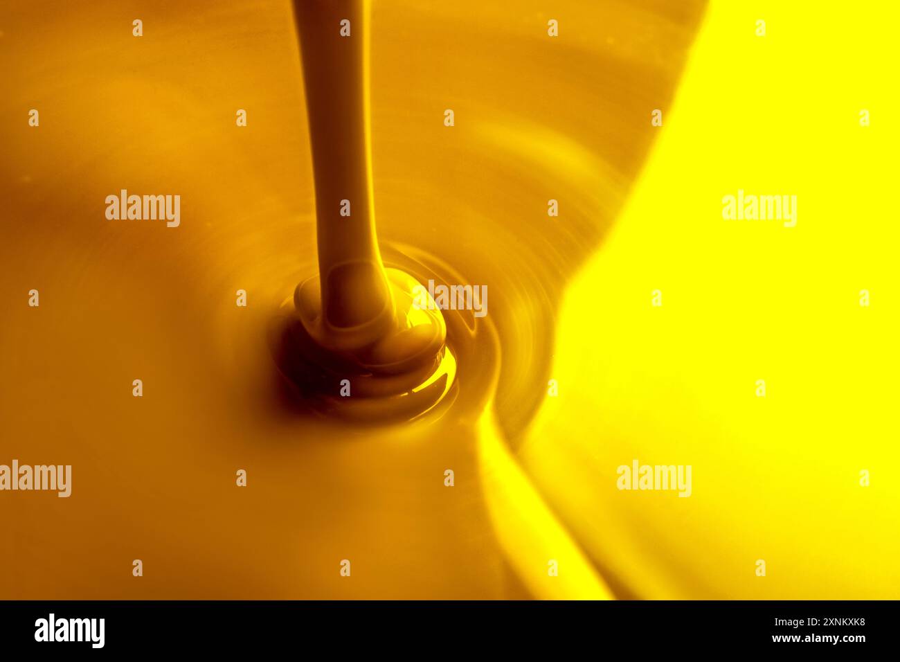 Pouring gold fluid as background, closeup view Stock Photo - Alamy