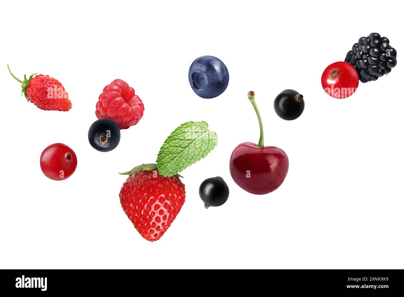 Different fresh berries in air on white background Stock Photo - Alamy