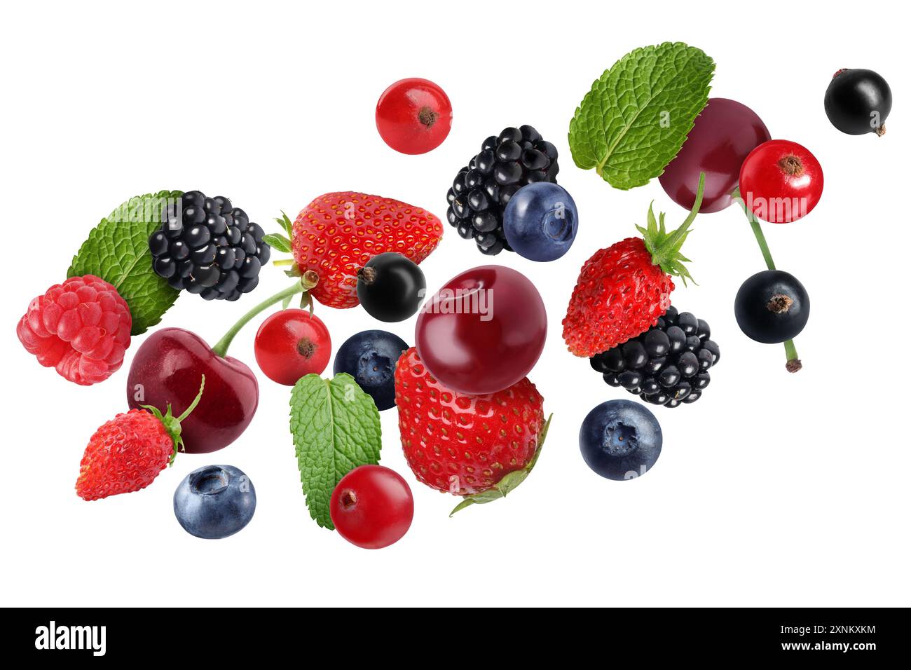 Different fresh berries in air on white background Stock Photo - Alamy
