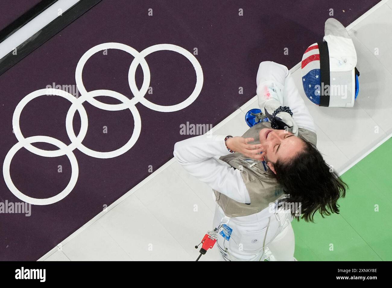 United States' Jaqueline Dubrovich, adjusts her hair as she competes ...