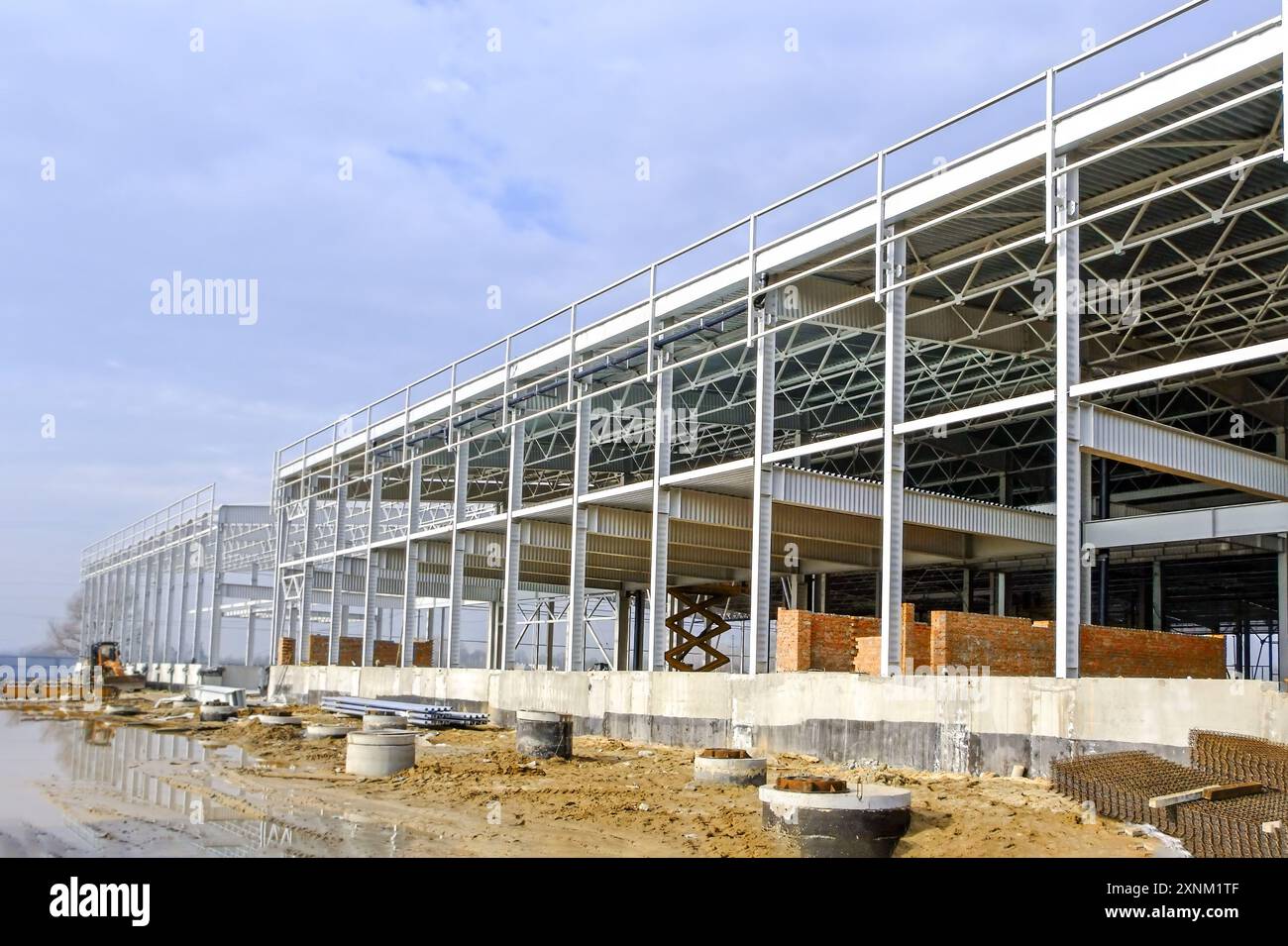 Large industrial building under construction with steel framework and ...