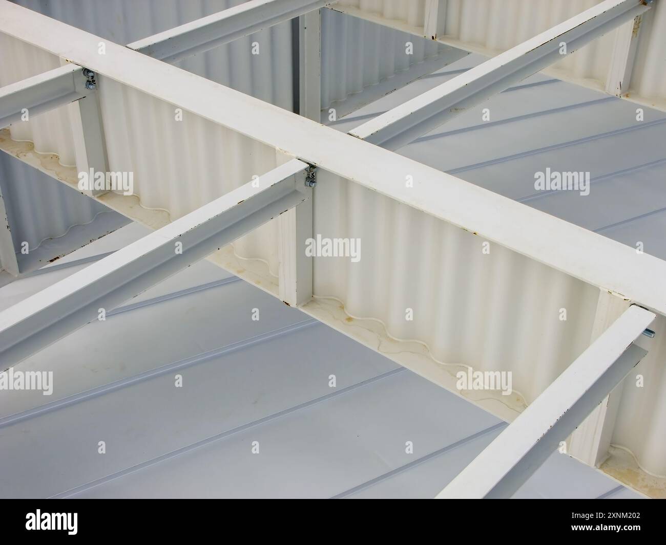 Construction site showcasing the steel roof framework of a new ...