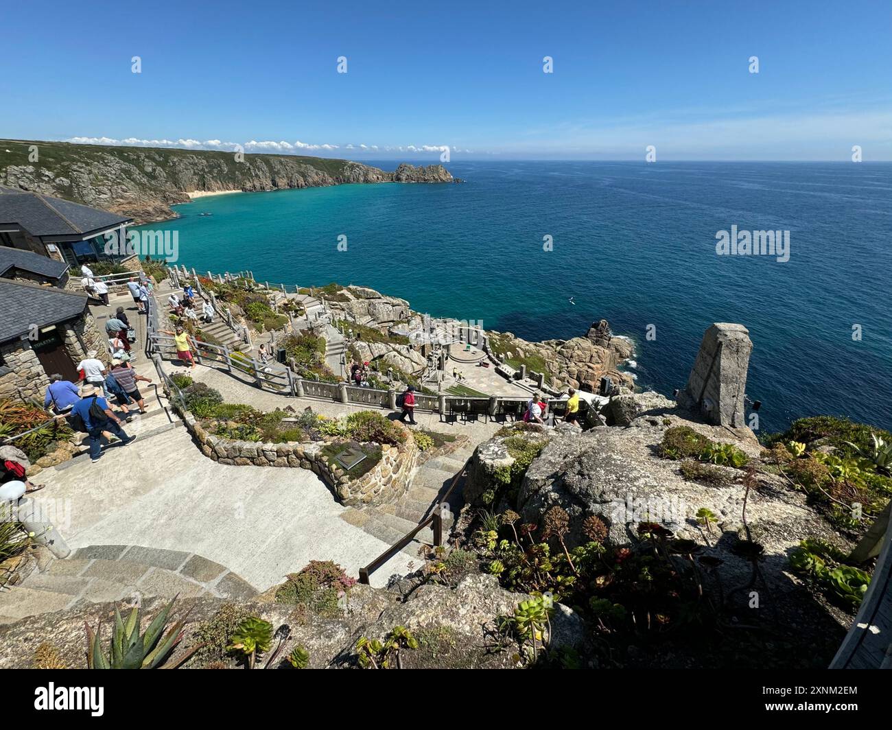 View looking down on The Minack Theatre with blue sea and sky behind ...