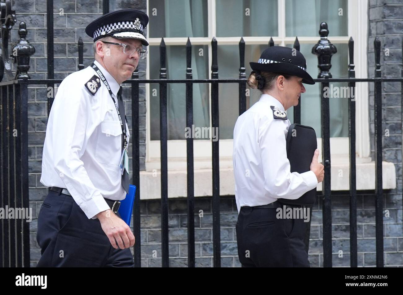 Metropolitan Police Assistant Commissioner Matt Twist (centre) and ...