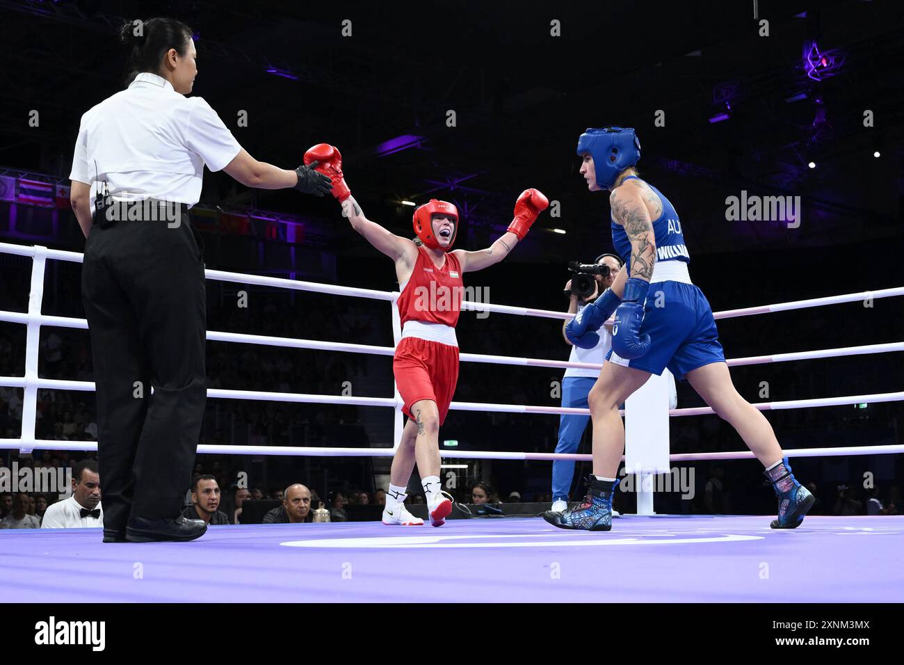 Anna Luca Hamori of Hungary (centre) celebrates between rounds against ...