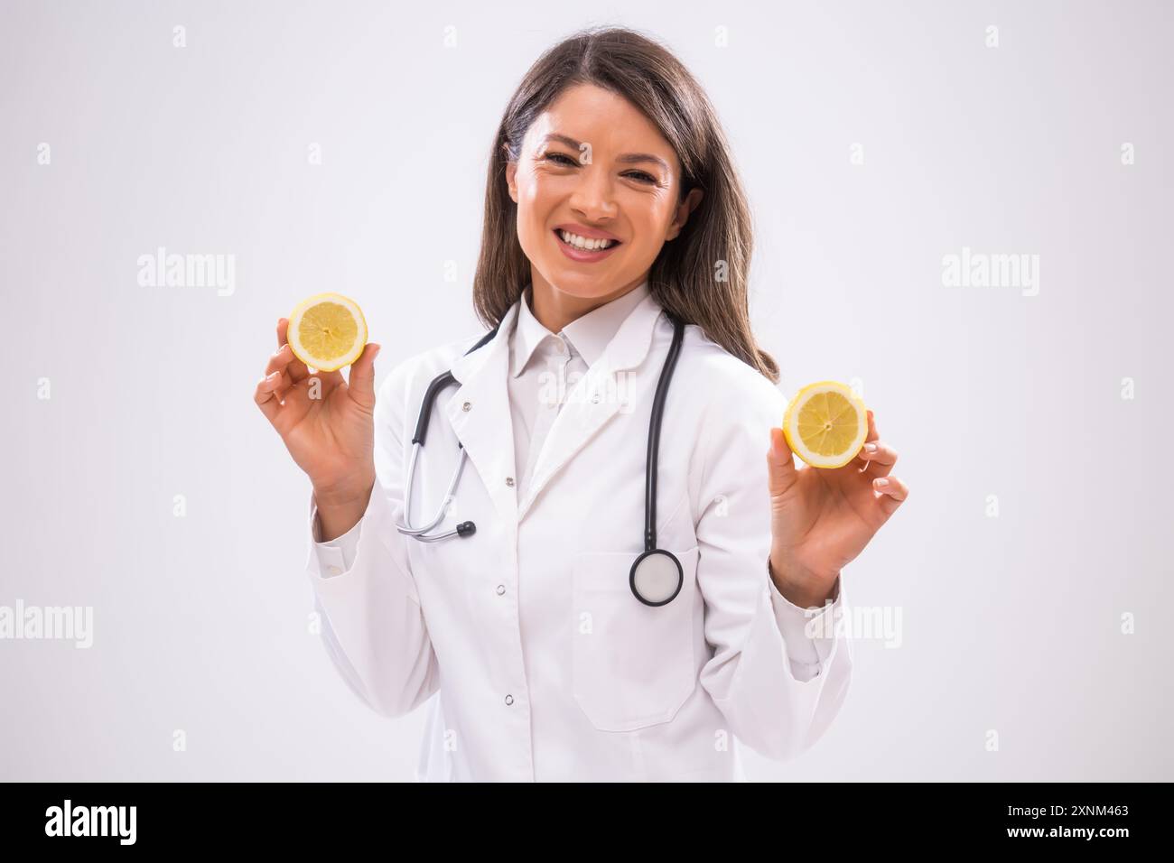Portrait of doctor who is happy and holding lemon Stock Photo - Alamy