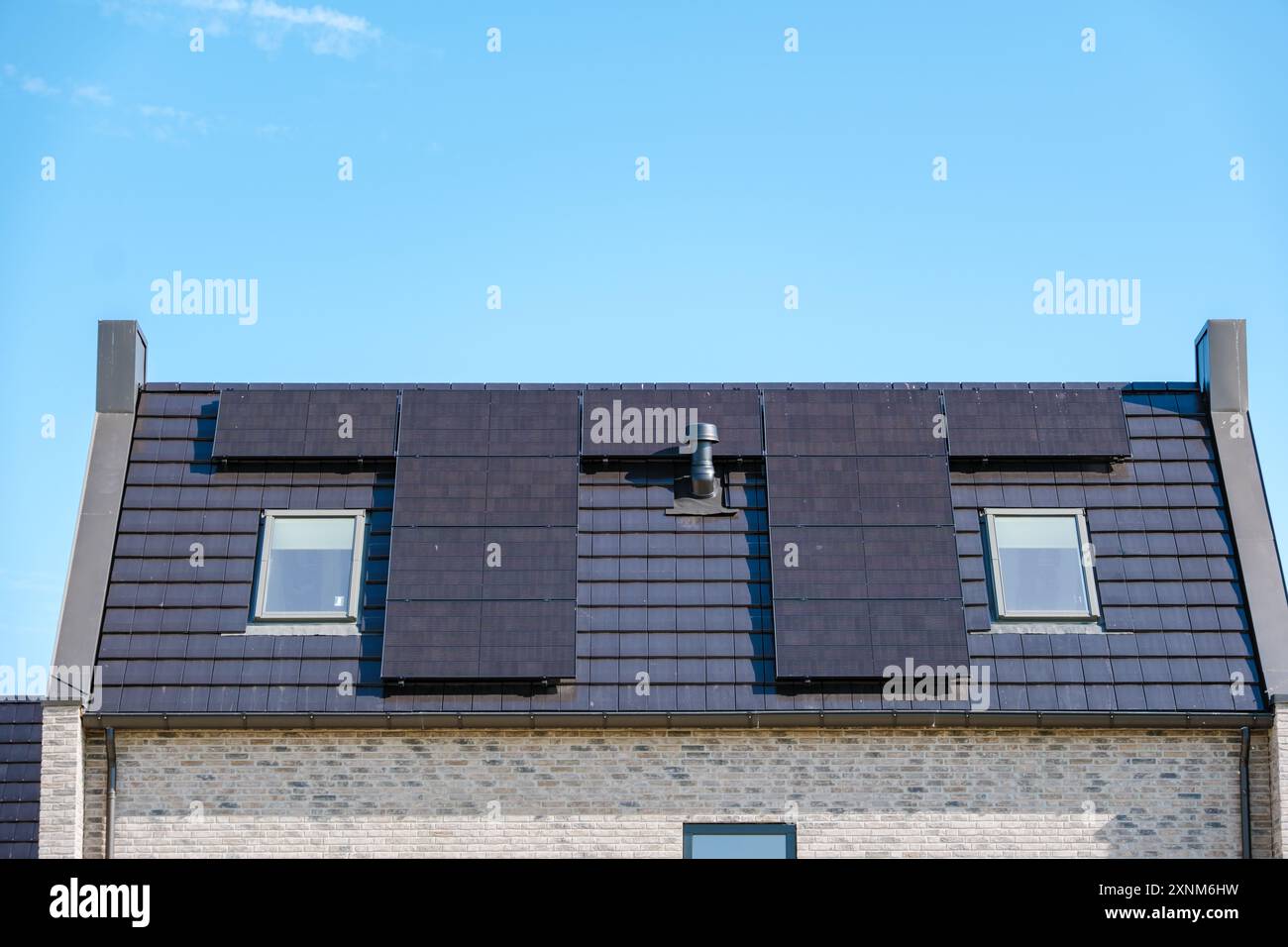 Solar panels installed on a contemporary roof, converting sunlight into ...