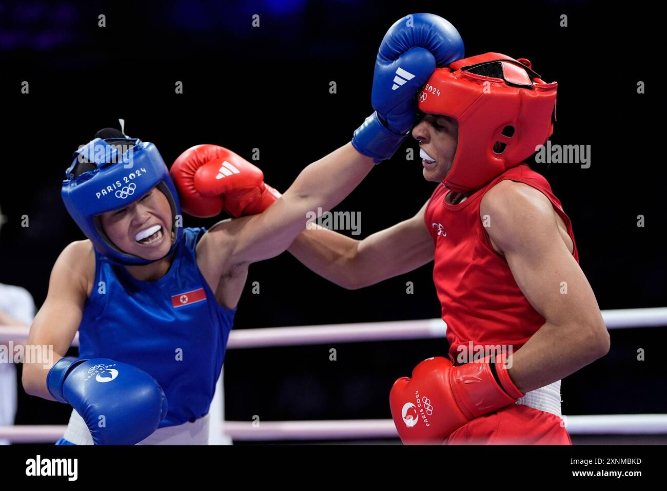 Morocco's Widad Bertal, right, fights North Korea's Cholmi Pang in ...