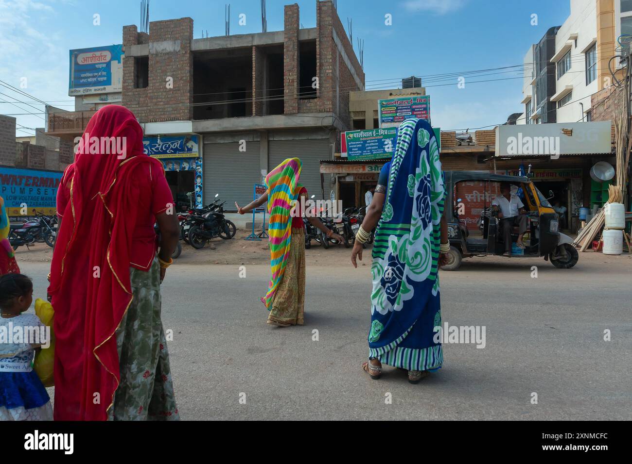 Indian woman crossing street hi-res stock photography and images - Alamy
