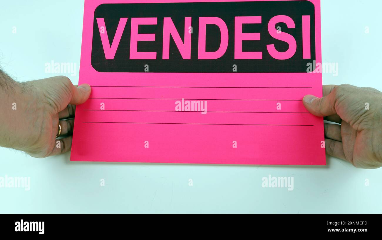 House FOR SALE "VENDESI" sign in real estate agency a word written in ...