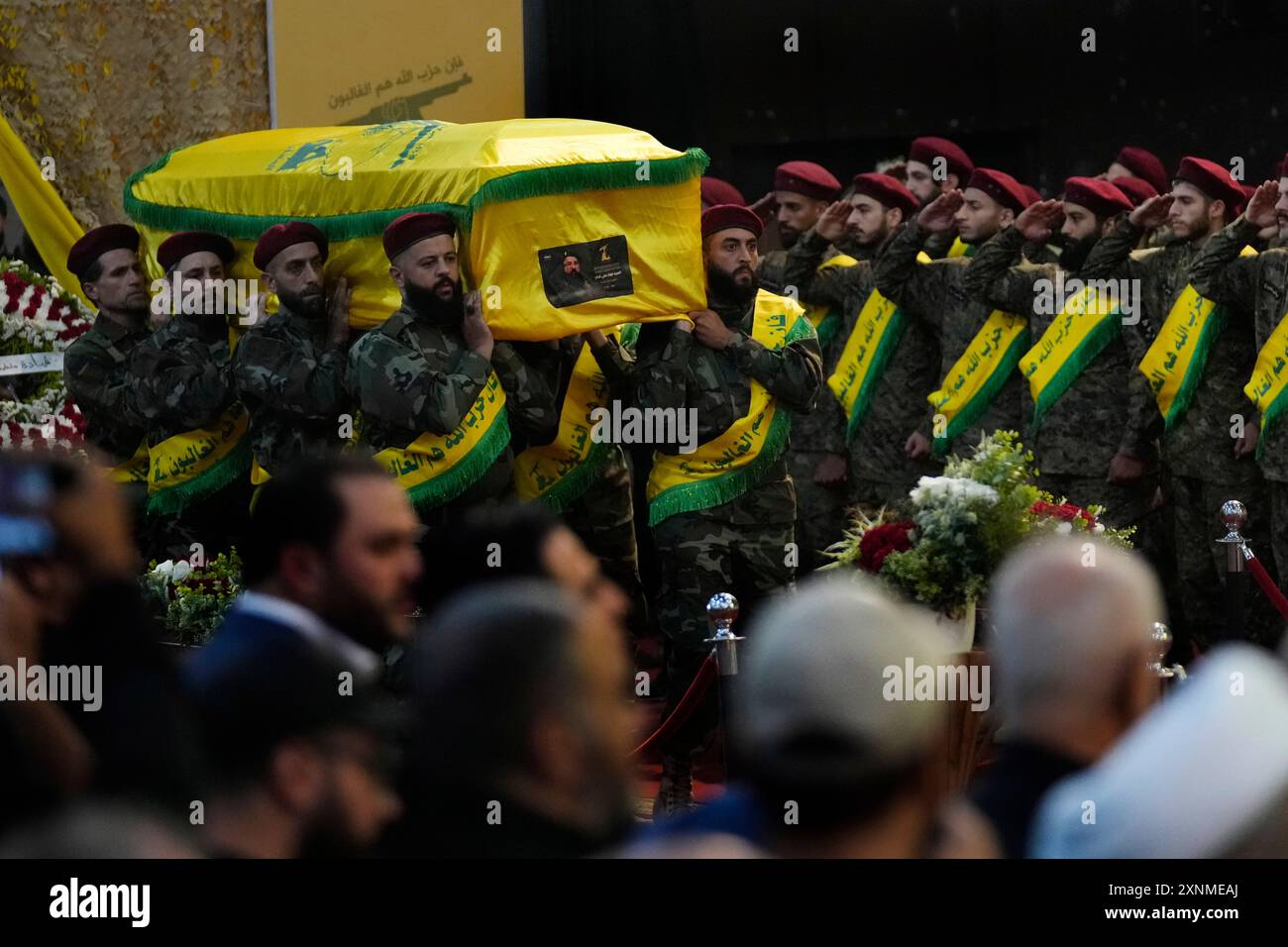 Hezbollah fighters carry the coffin of their top commander Fouad Shukur ...
