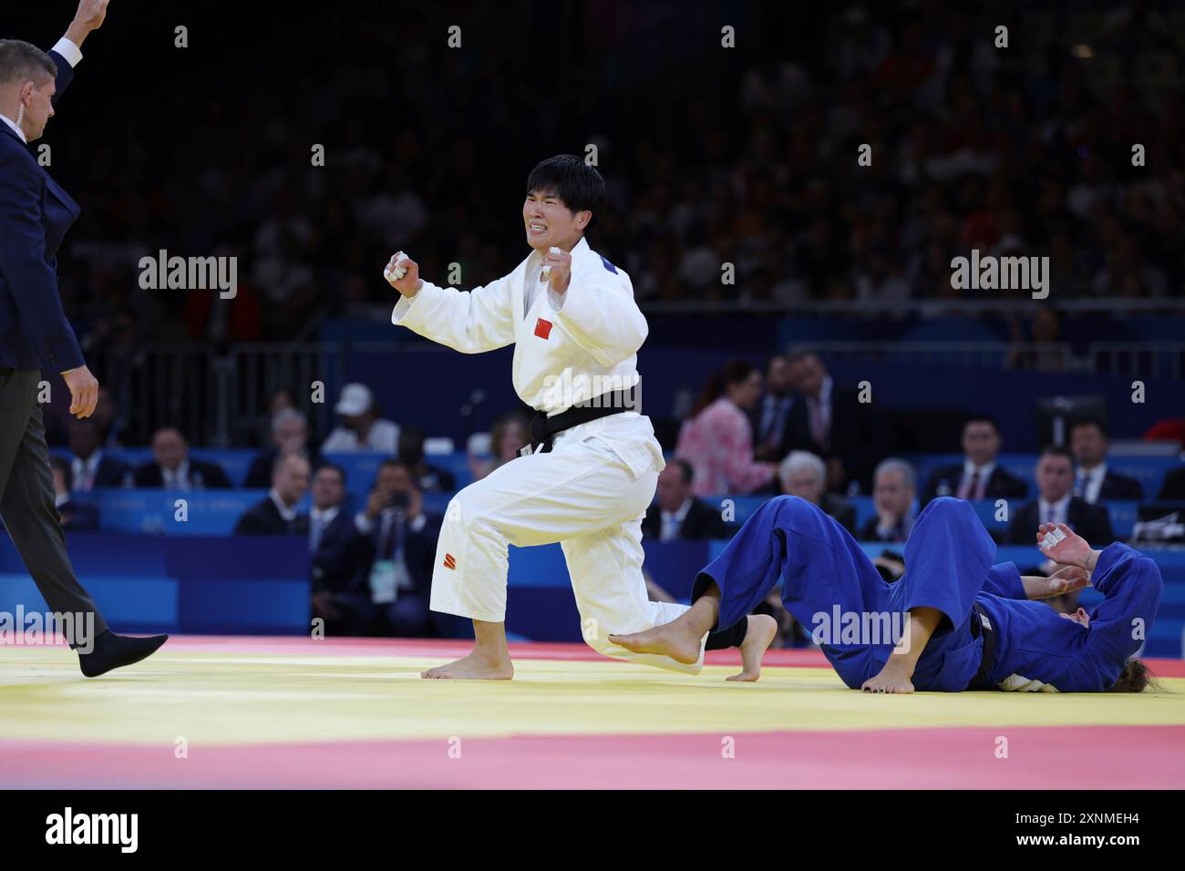 MA Zhenzhao of People's Republic of China(white) reacts after winning the women's Judo -78 kg ...