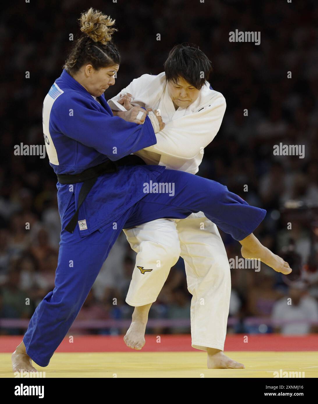 Japan's Rika Takayama (white) competes against Portugal's Patricia ...