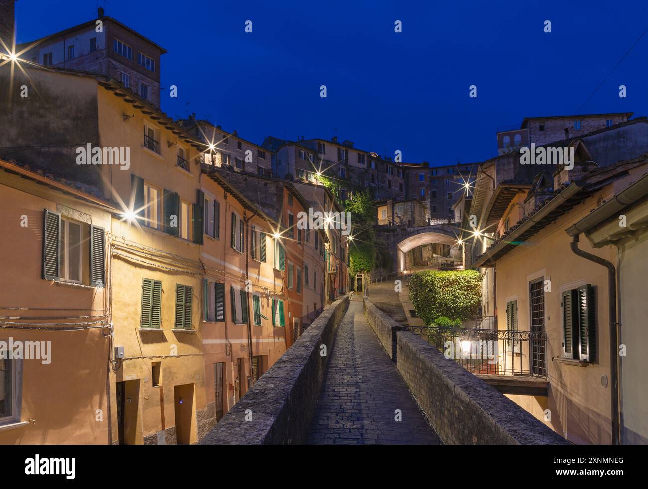 Perugia - The aqueduct and old town at dusk Stock Photo - Alamy