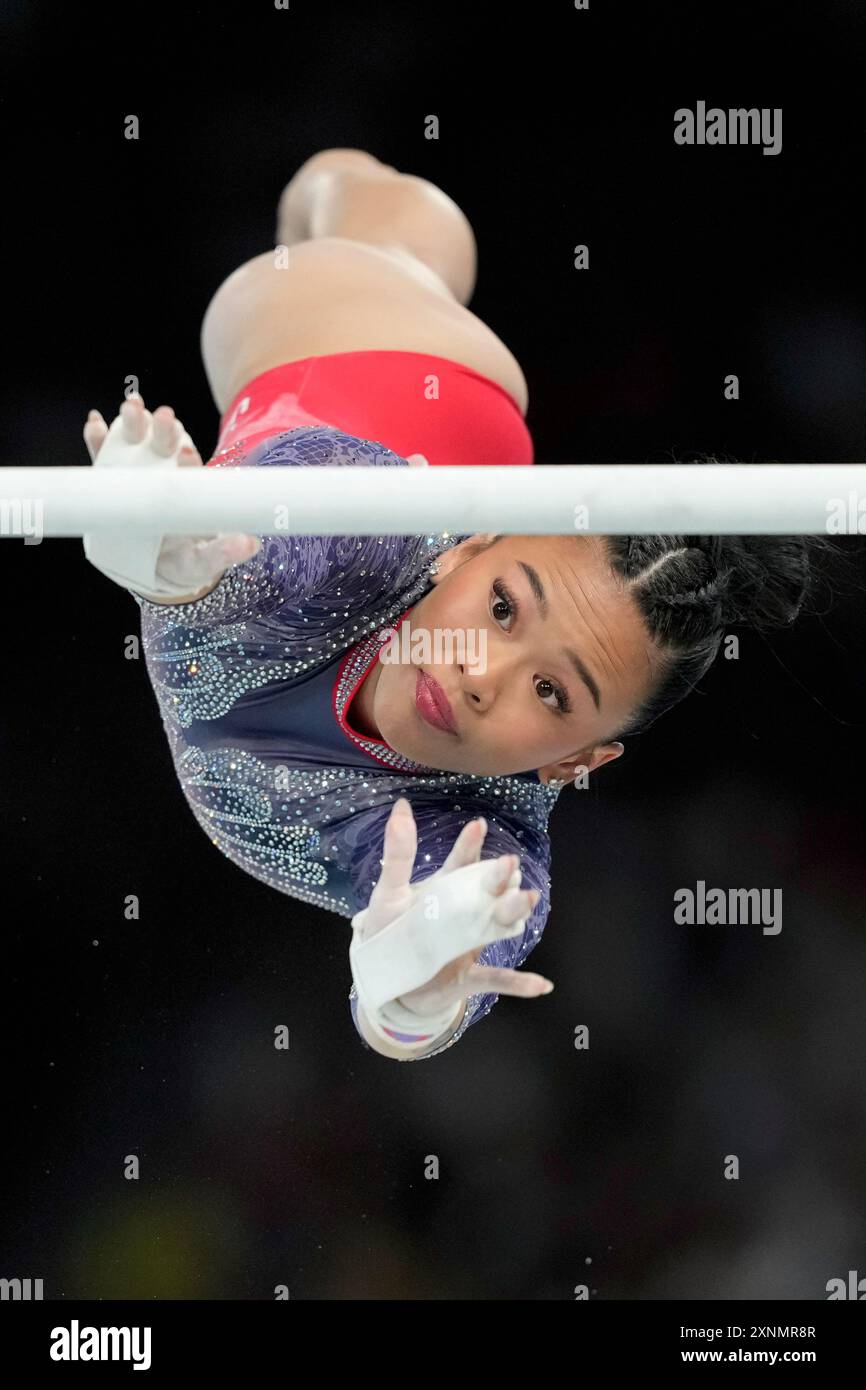 Suni Lee, of the United States, performs on the uneven bars during the ...