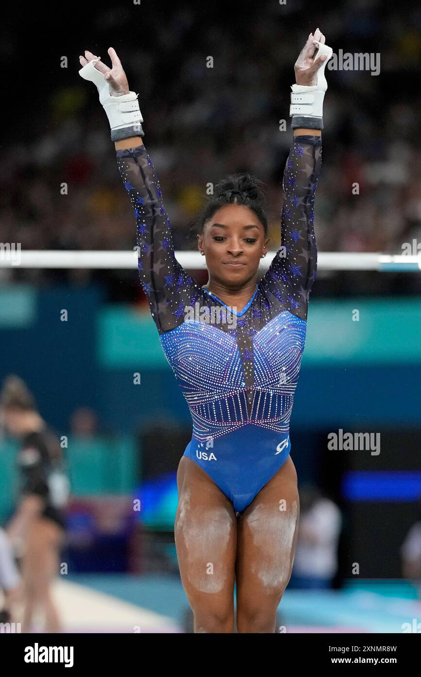 Simone Biles, of the United States, after performing on the uneven bars ...