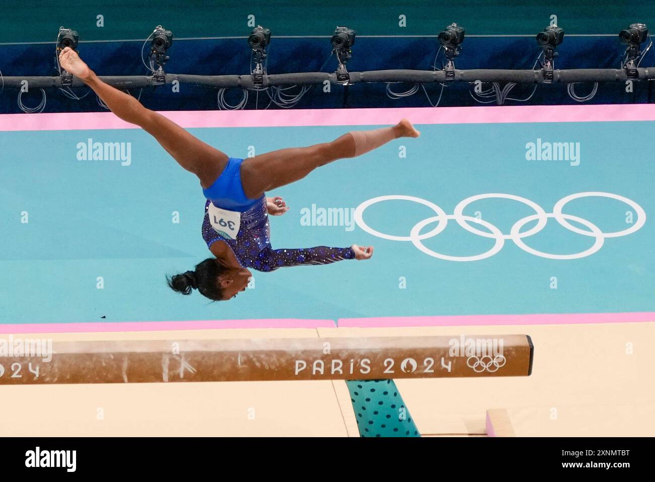 Simone Biles, of the United States, performs on the balance beam during ...