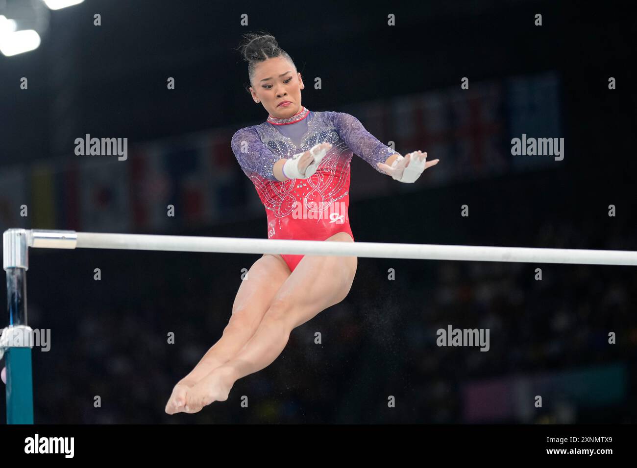 Suni Lee, of the United States, performs on the uneven bars during the ...