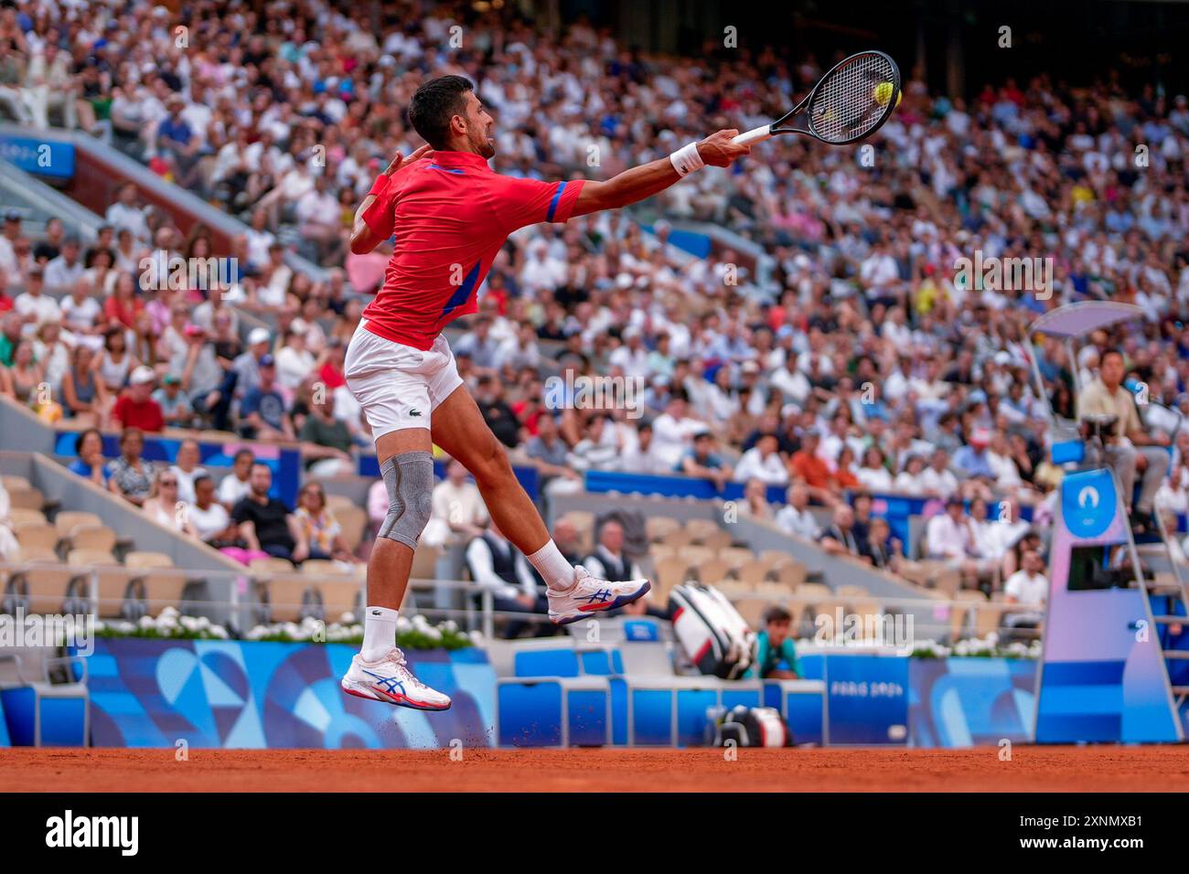 Serbia's Novak Djokovic returns the ball against Stefanos Tsitsipas of ...