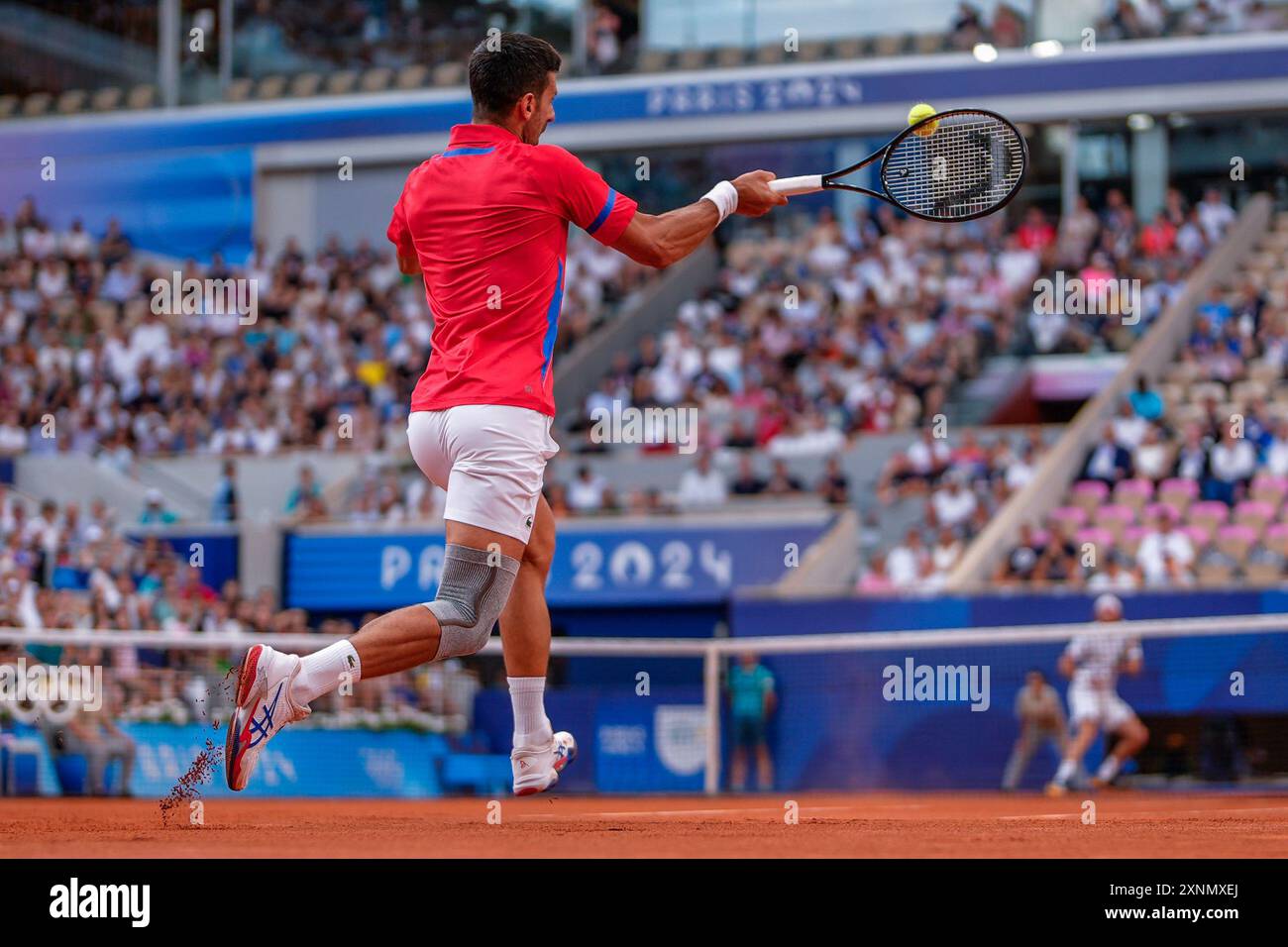 Serbia's Novak Djokovic returns the ball against Stefanos Tsitsipas of ...