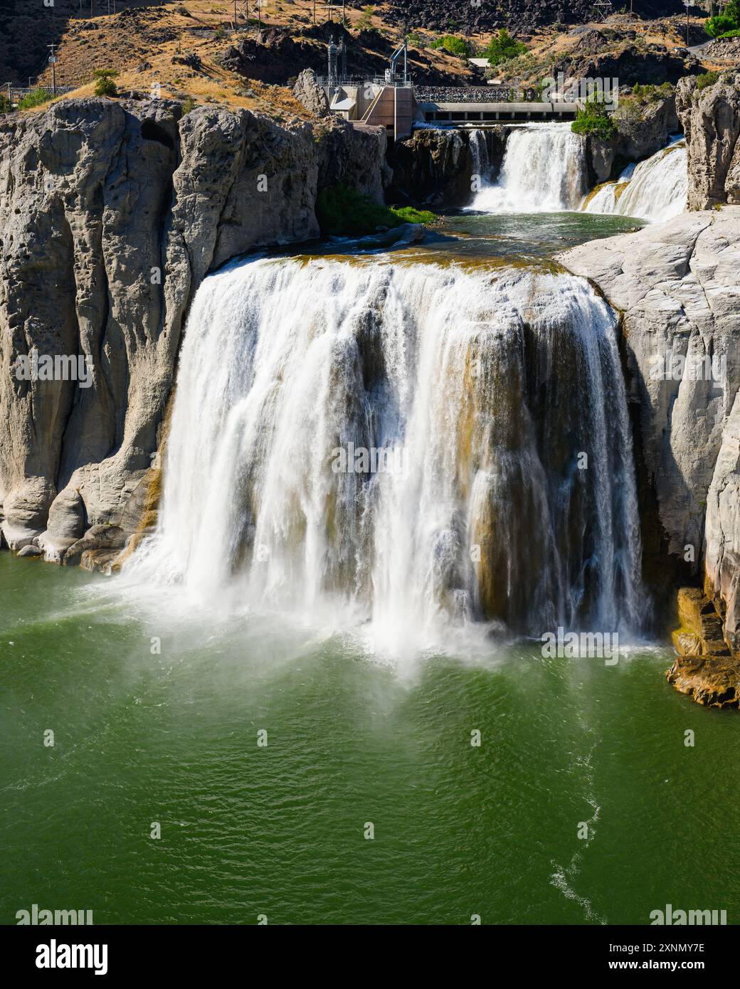 Shoshone Falls flowing over rock in summer with green water pool Stock ...