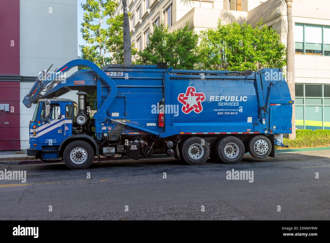 Anaheim, CA, USA - July 26, 2024: A front loader waste truck operated ...