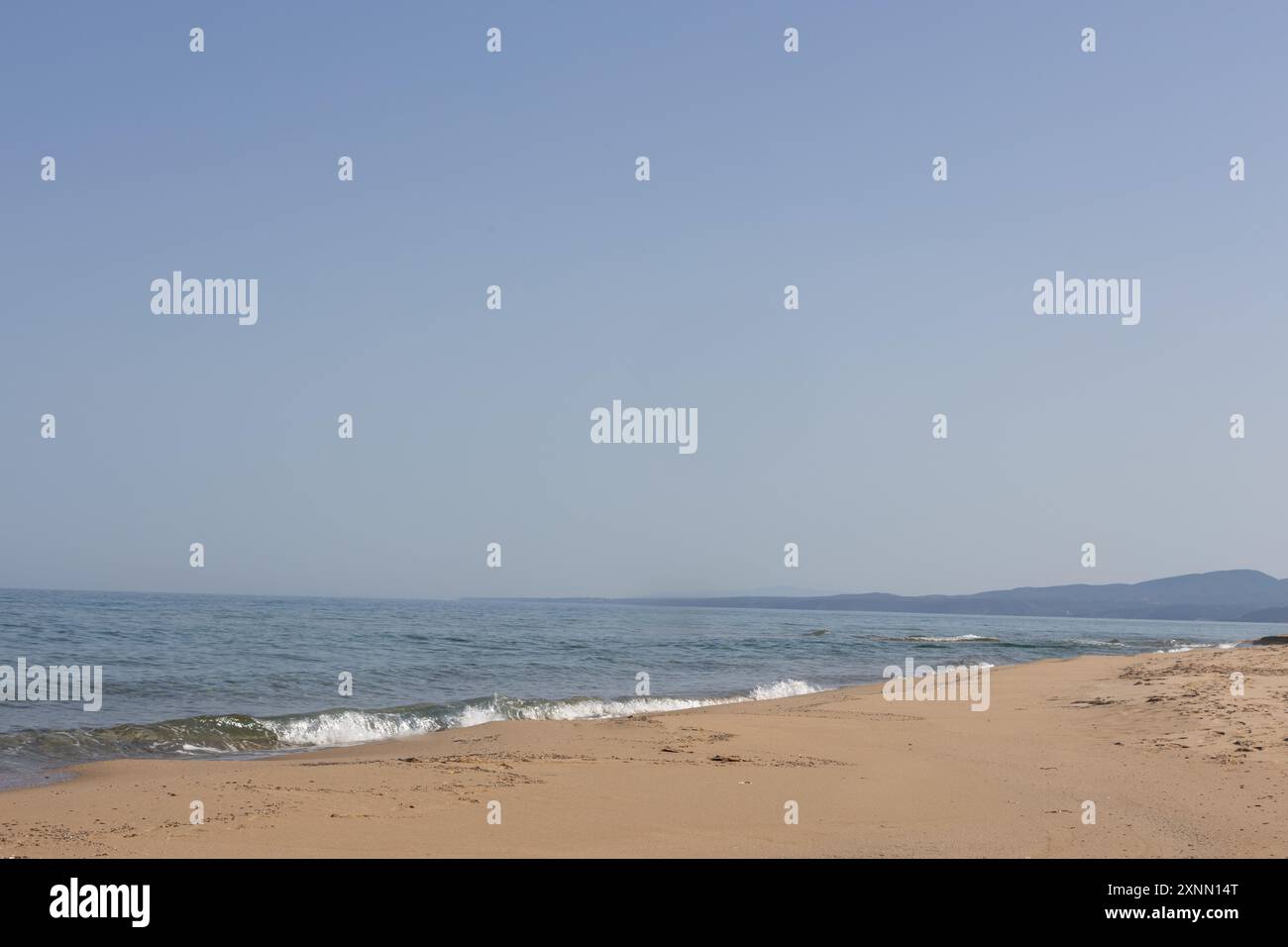 Serene empty beach gentle waves hi-res stock photography and images - Alamy