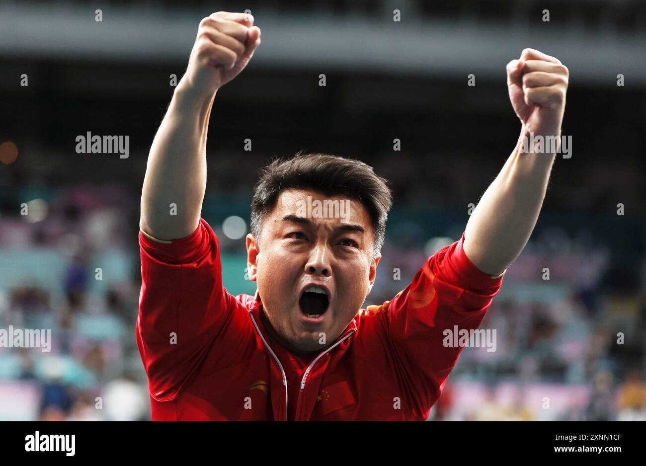 Paris, France. 1st Aug, 2024. Coach Wang Hao of China celebrates after ...