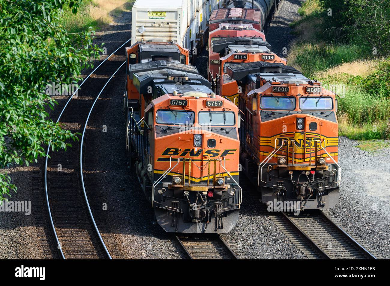 Everett, WA, USA - July 17, 2024; Pair of BNSF freight trains together on curve with multiple ...