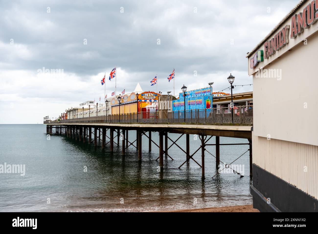 Side on view of the Victorian pier in the seaside town of Paignton on ...