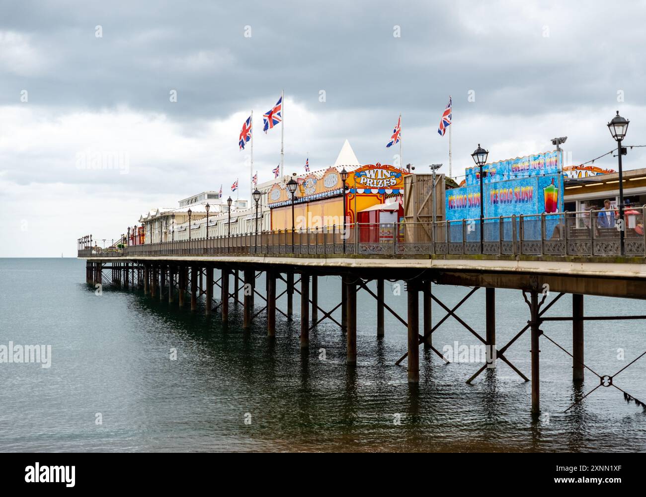 Side on view of the Victorian pier in the seaside town of Paignton on ...