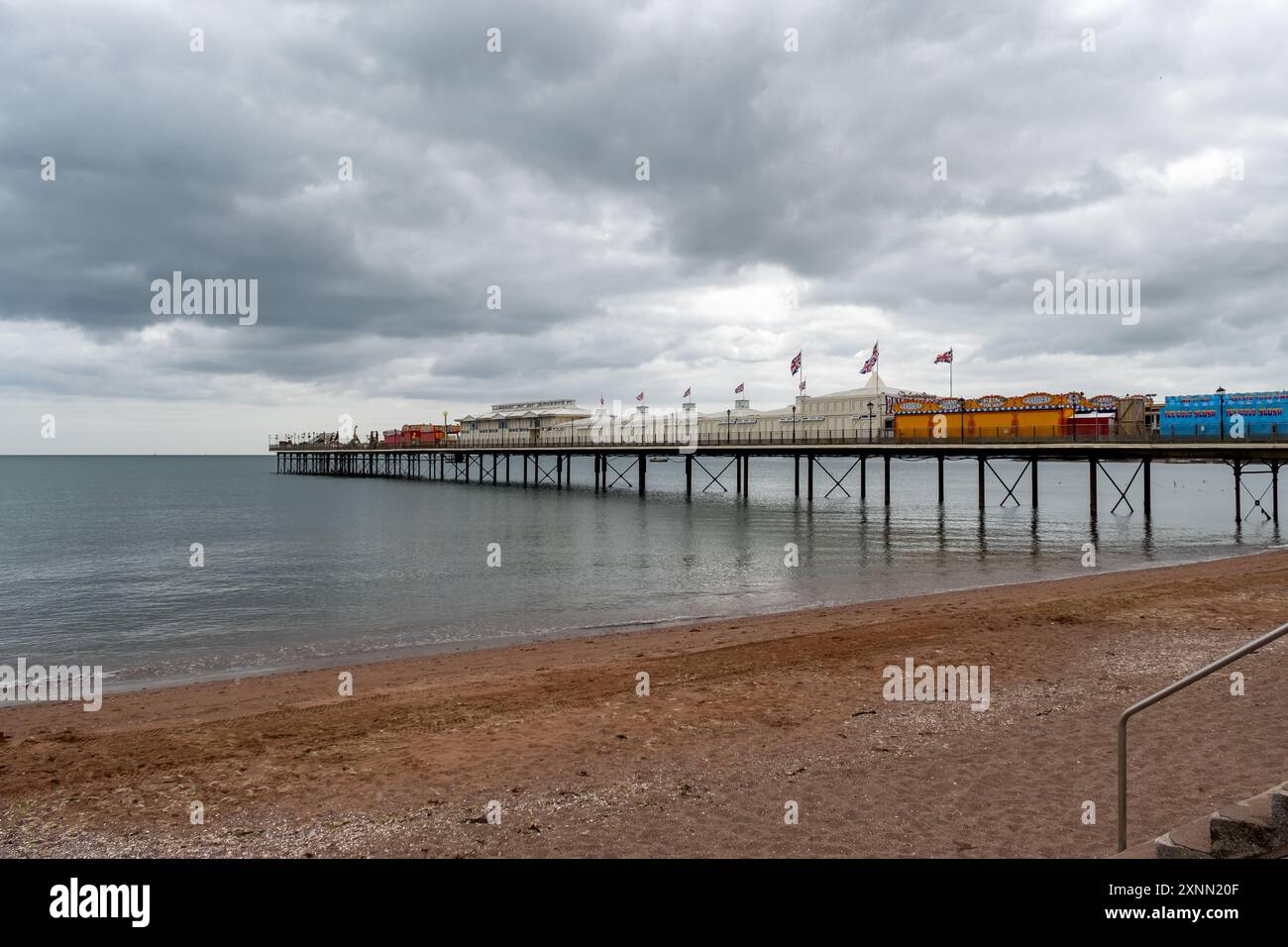 Side on view of the Victorian pier in the seaside town of Paignton on ...