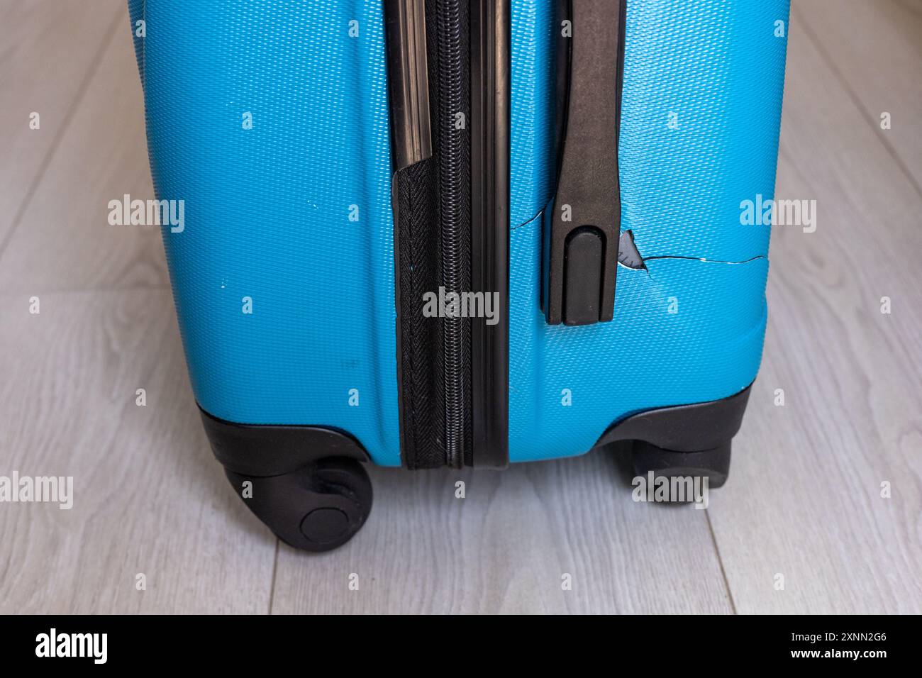 close-up of Damaged blue traveling Luggage at the Airport Stock Photo ...