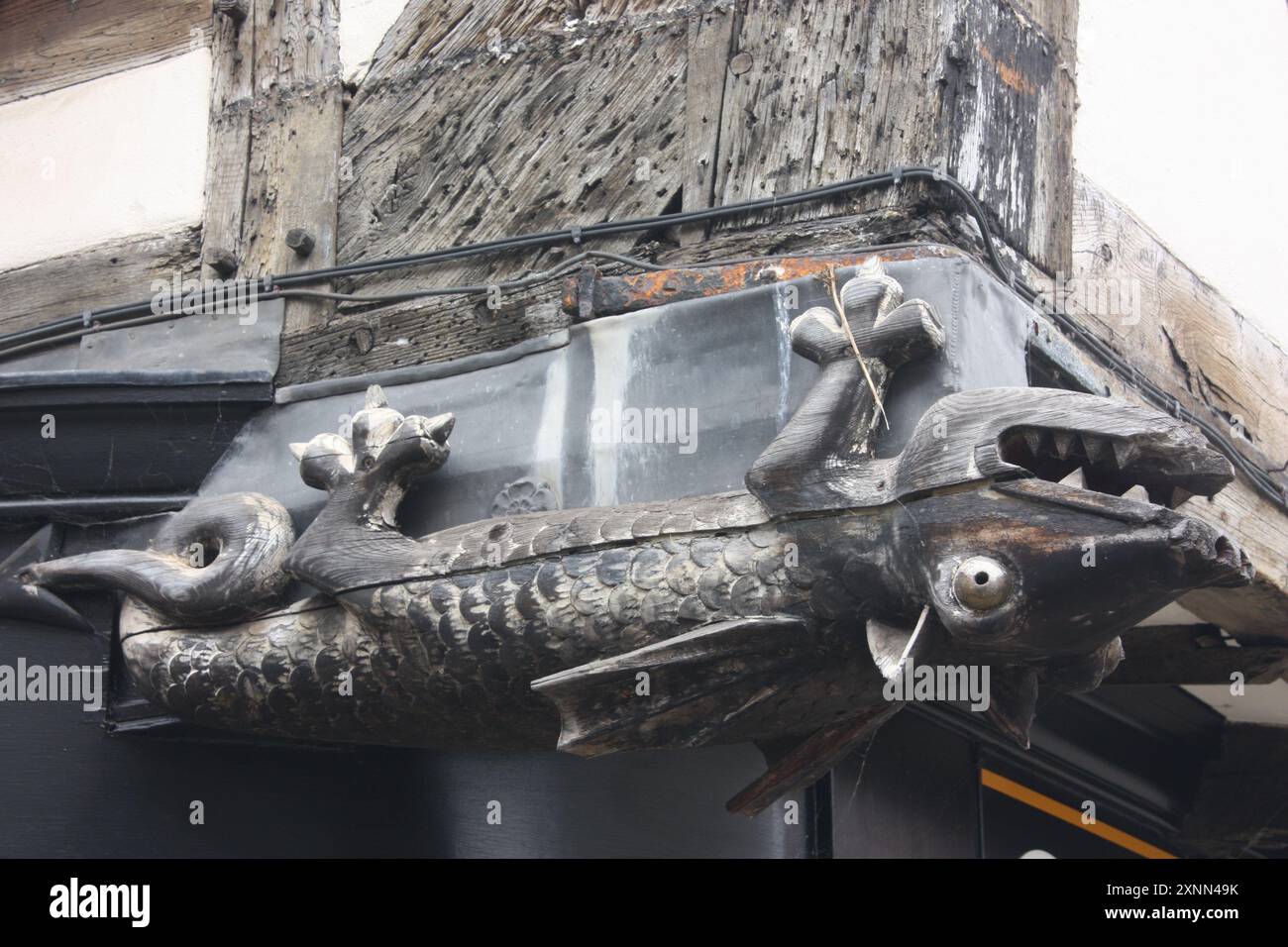 Wooden dragon supporting a beam in a Tudor house at the junction of ...