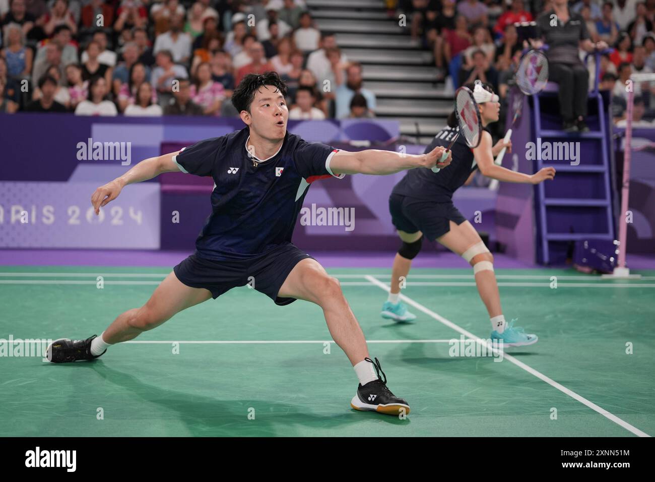 South Korea's Seo Sung-jae, left, and Chae Yu-jung play against their compatriots Kim Won-ho and ...