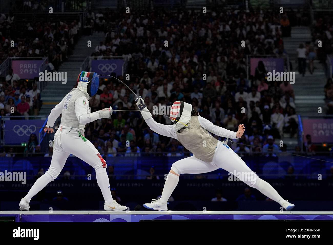 Italy's Alice Volpi, left, competes with United United States ...