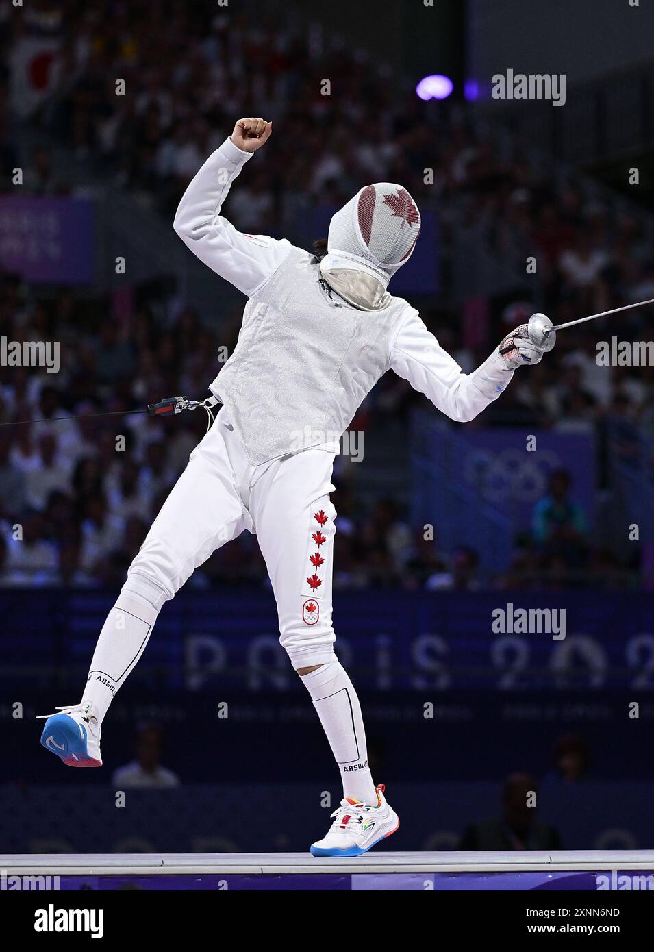 Paris, France. 1st Aug, 2024. Zhang Yunjia (L) of Canada reacts while competing against Ueno ...