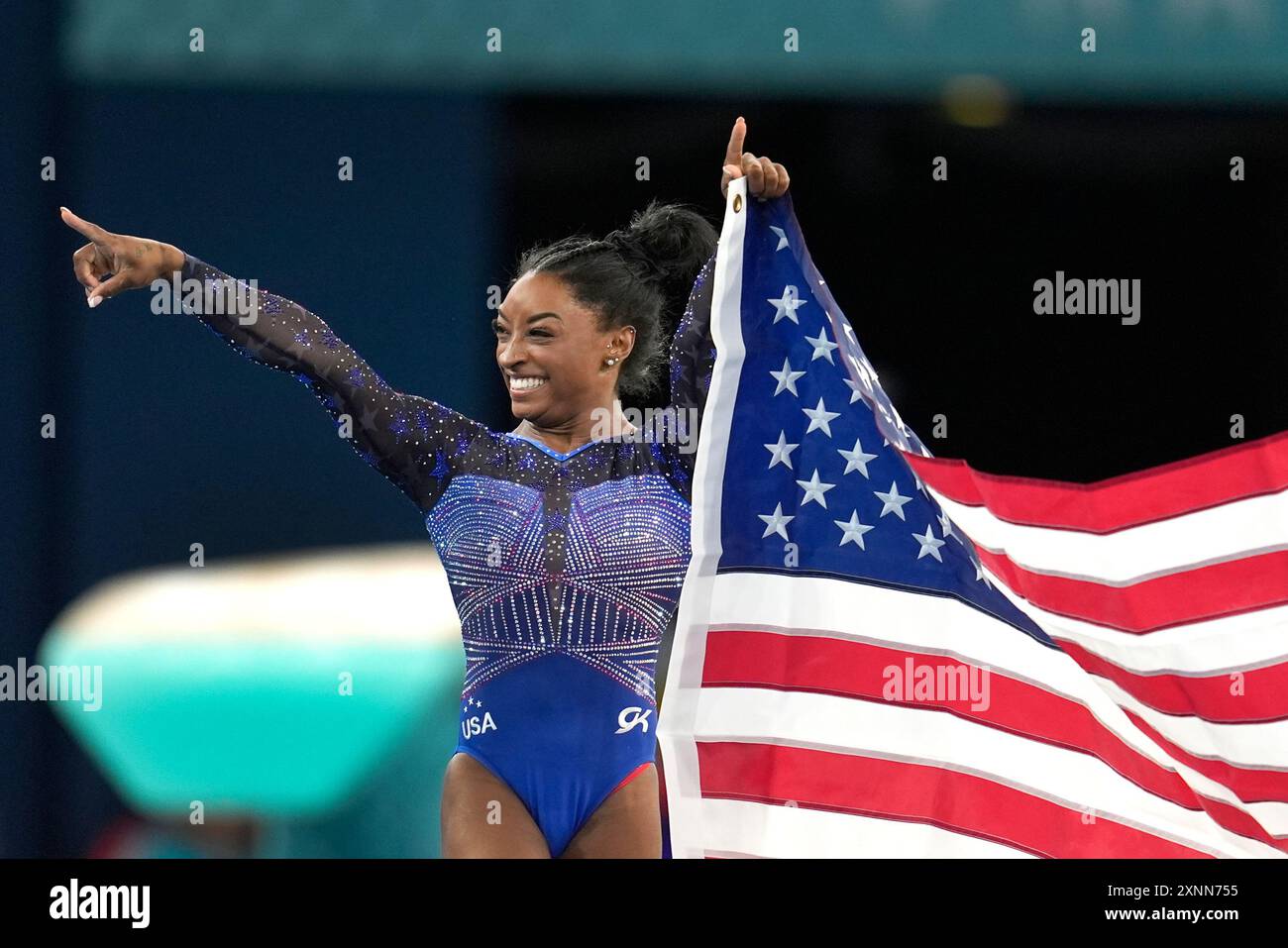 Simone Biles, of the United States, celebrates after winning the gold ...