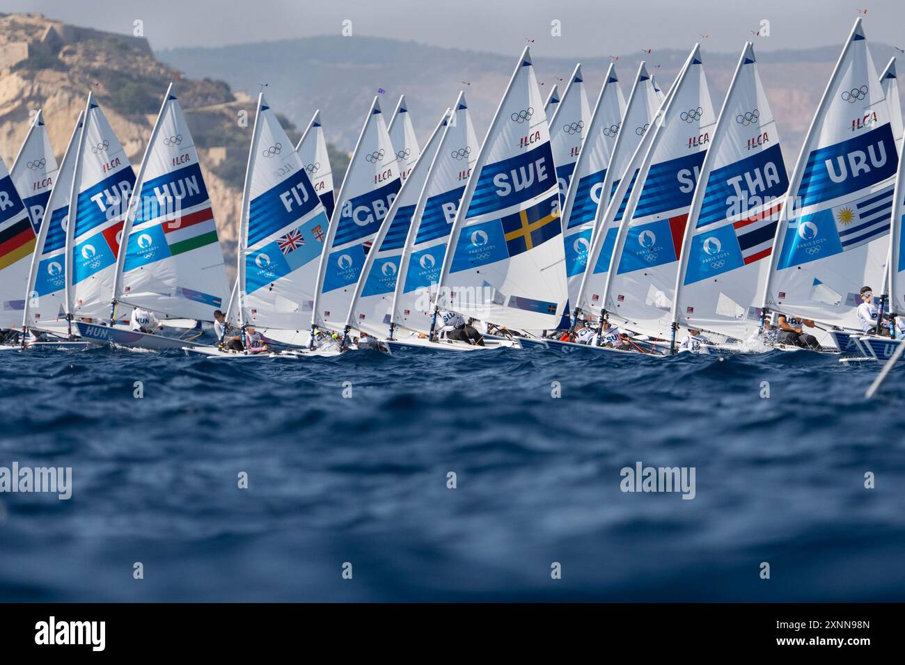 A fleet of boats from around the world take off, at the start of a ...