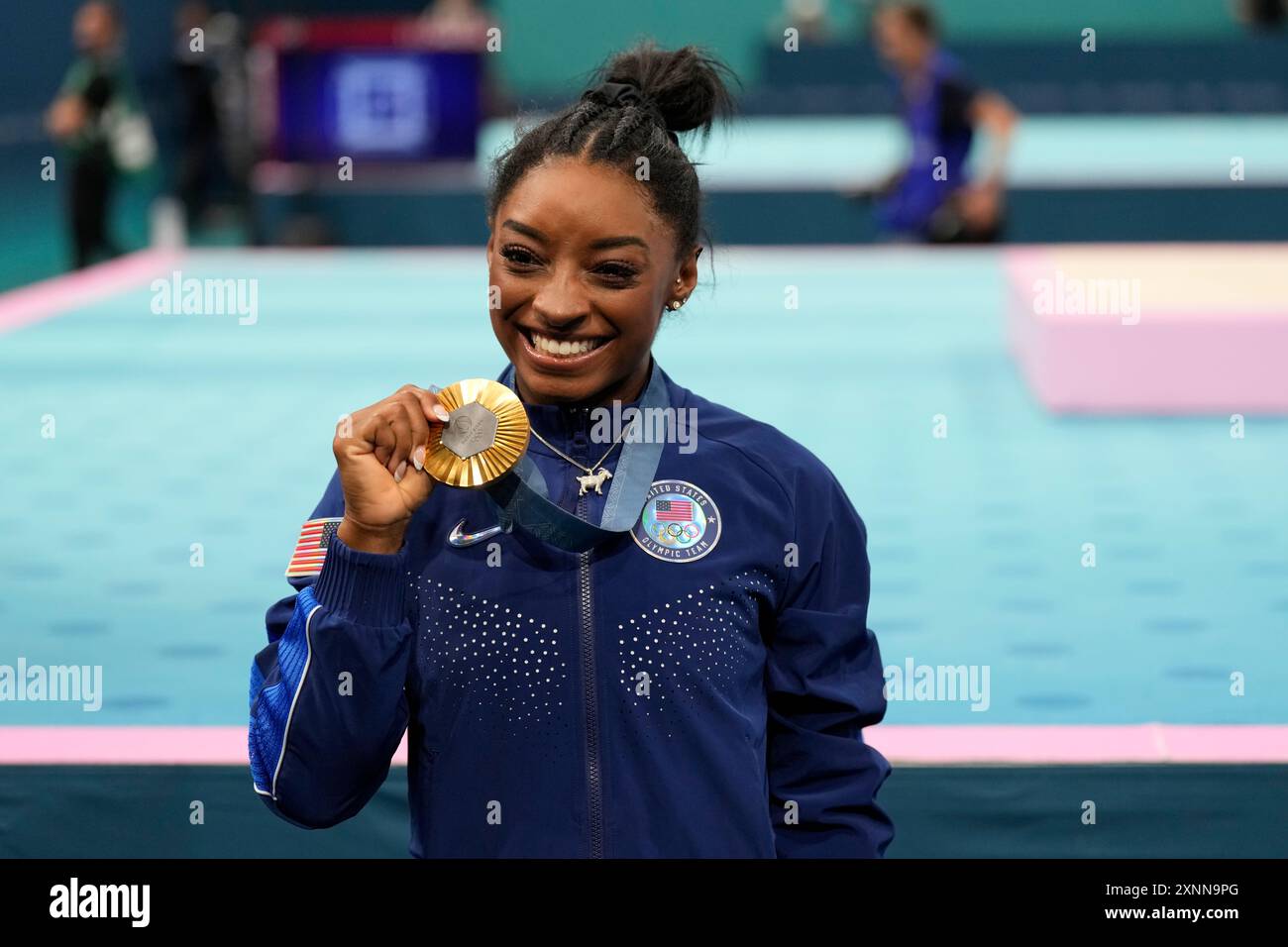 Simone Biles, of the United States, celebrates after winning the gold ...